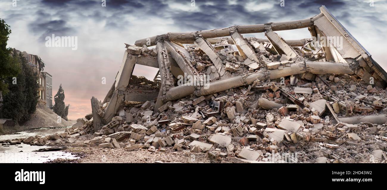 View on a collapsed concrete industrial building with dark dramatic sky ...