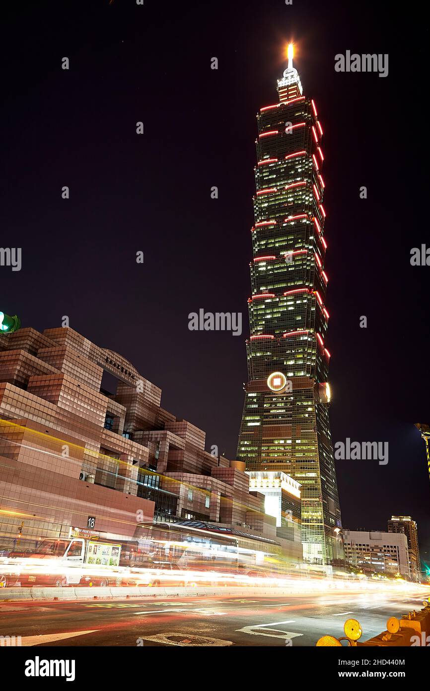 View of the iconic Taipei 101 tower at night against the backdrop of ...