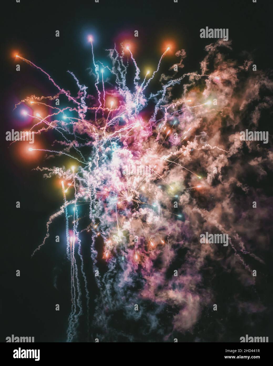 Vertical shot of colorful fireworks in the night sky Stock Photo - Alamy