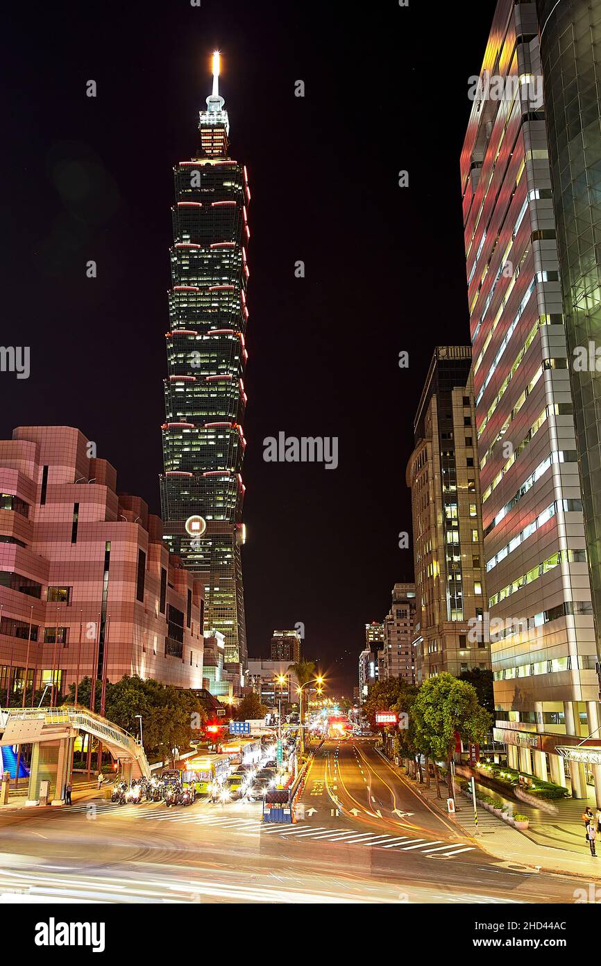 View of the iconic Taipei 101 tower at night against the backdrop of ...