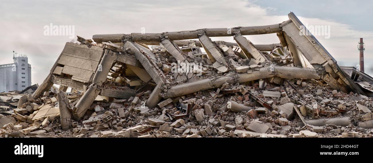 Collapsed and destroyed concrete industrial building isolated on white ...