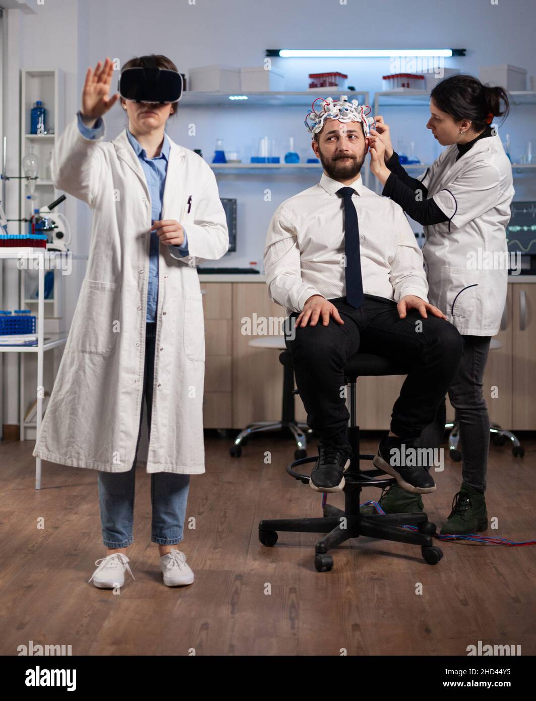 Researcher woman wearing virtual reality headset during neurology ...