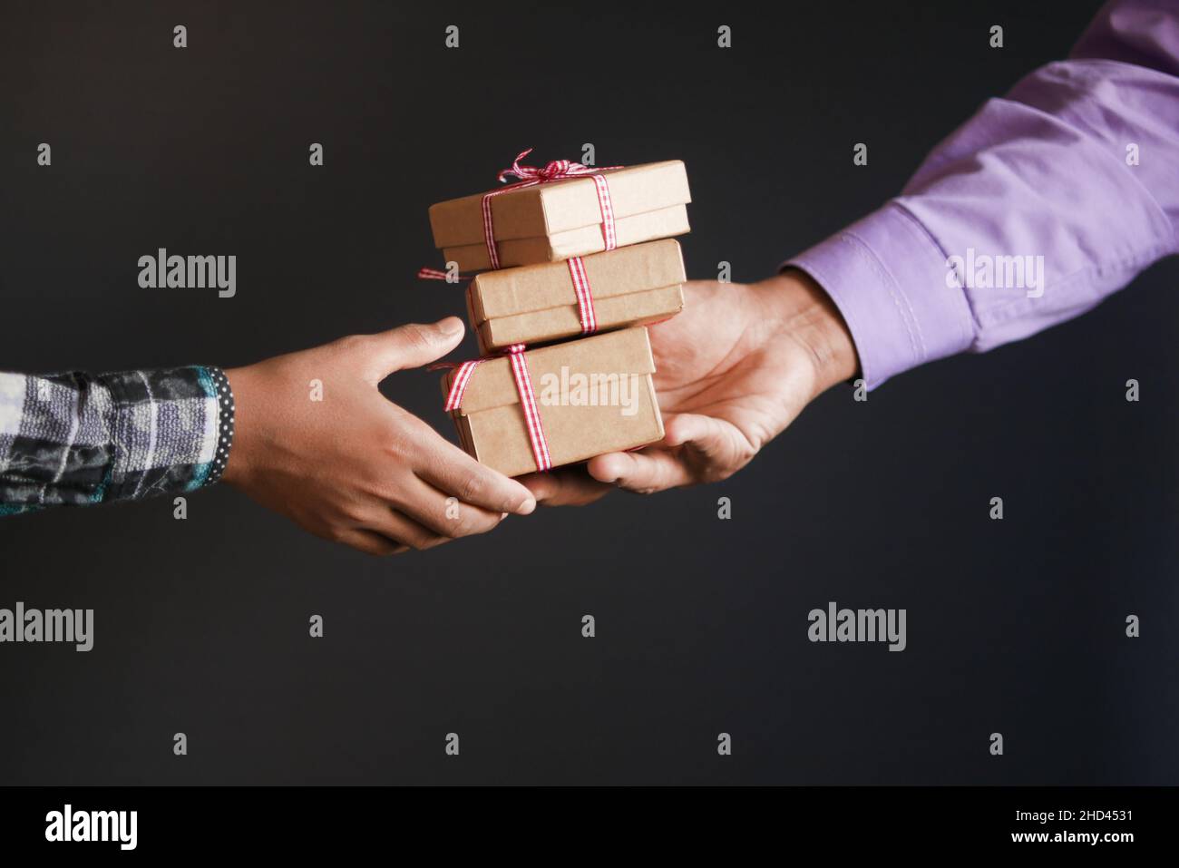 men hand giving homemade gift box Stock Photo - Alamy
