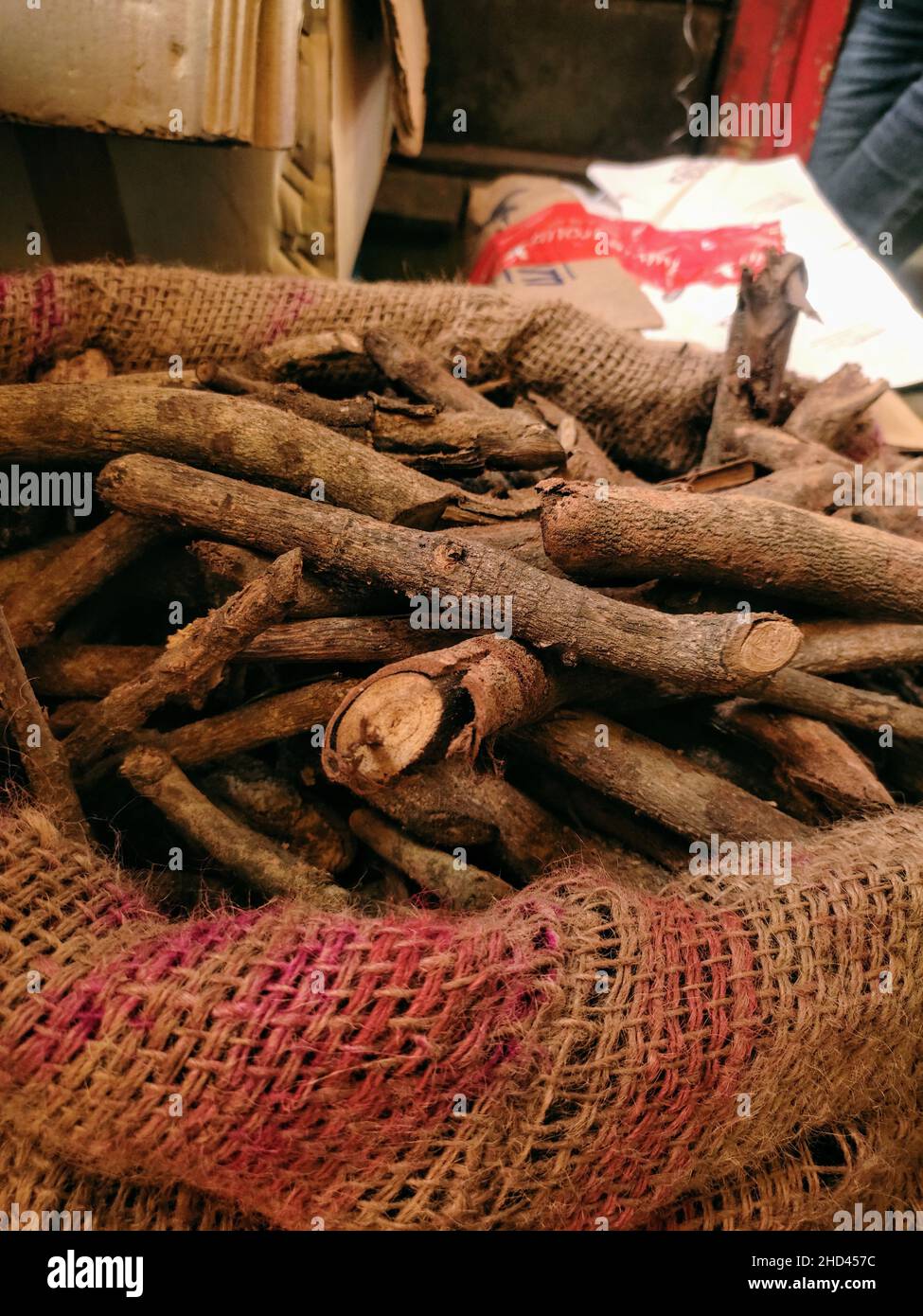 Vertical shot of a pile of wooden sticks in a sack Stock Photo - Alamy