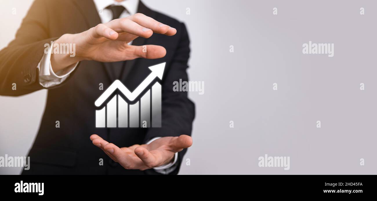Male hand holding graph icon symbol.checking analyzing sales data ...