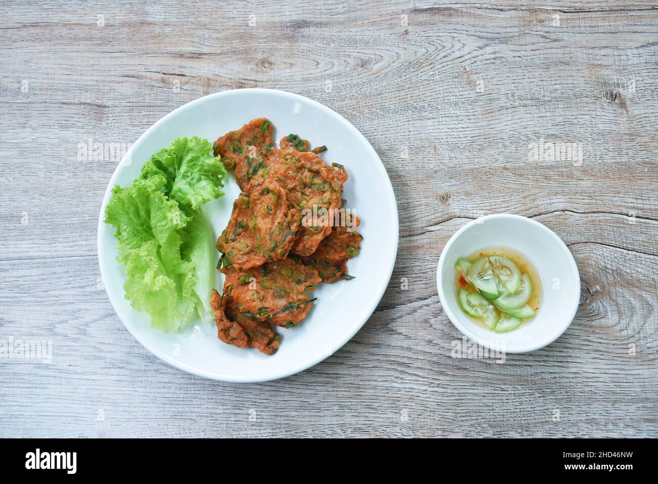 fried fish patty on plate dipping sweet chili sauce Stock Photo - Alamy