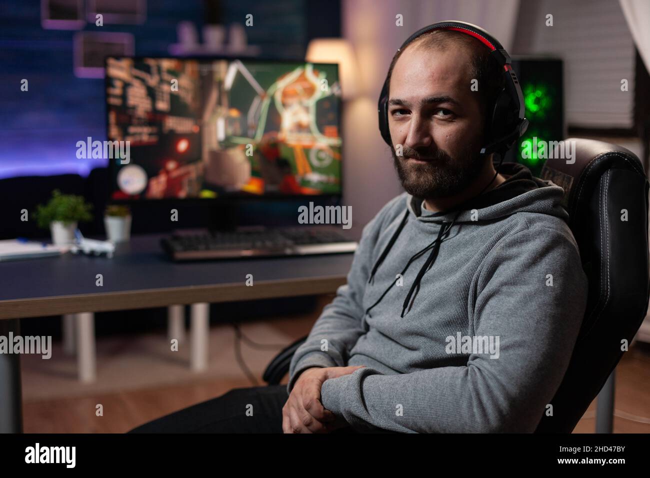 Portrait of man preparing to play video games on computer. Gamer with ...