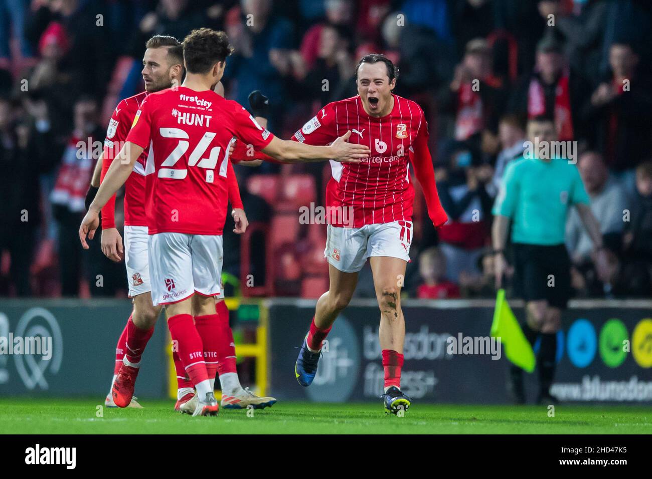 Swindon Town's Harry McKirdy (right) celebrates scoring his sides ...