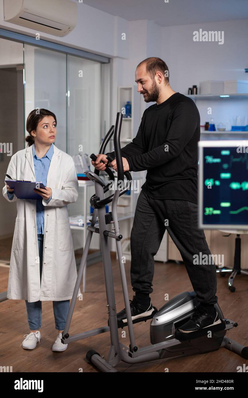 Athleteman in sport equipment working at body endurance during medical ...