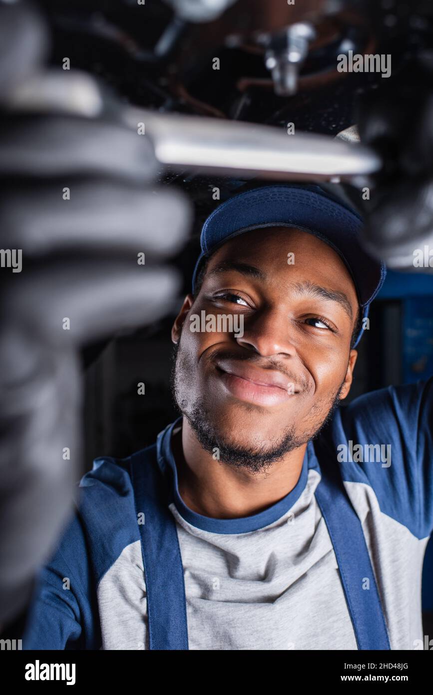 Mechanic in gloves working under hi-res stock photography and images ...