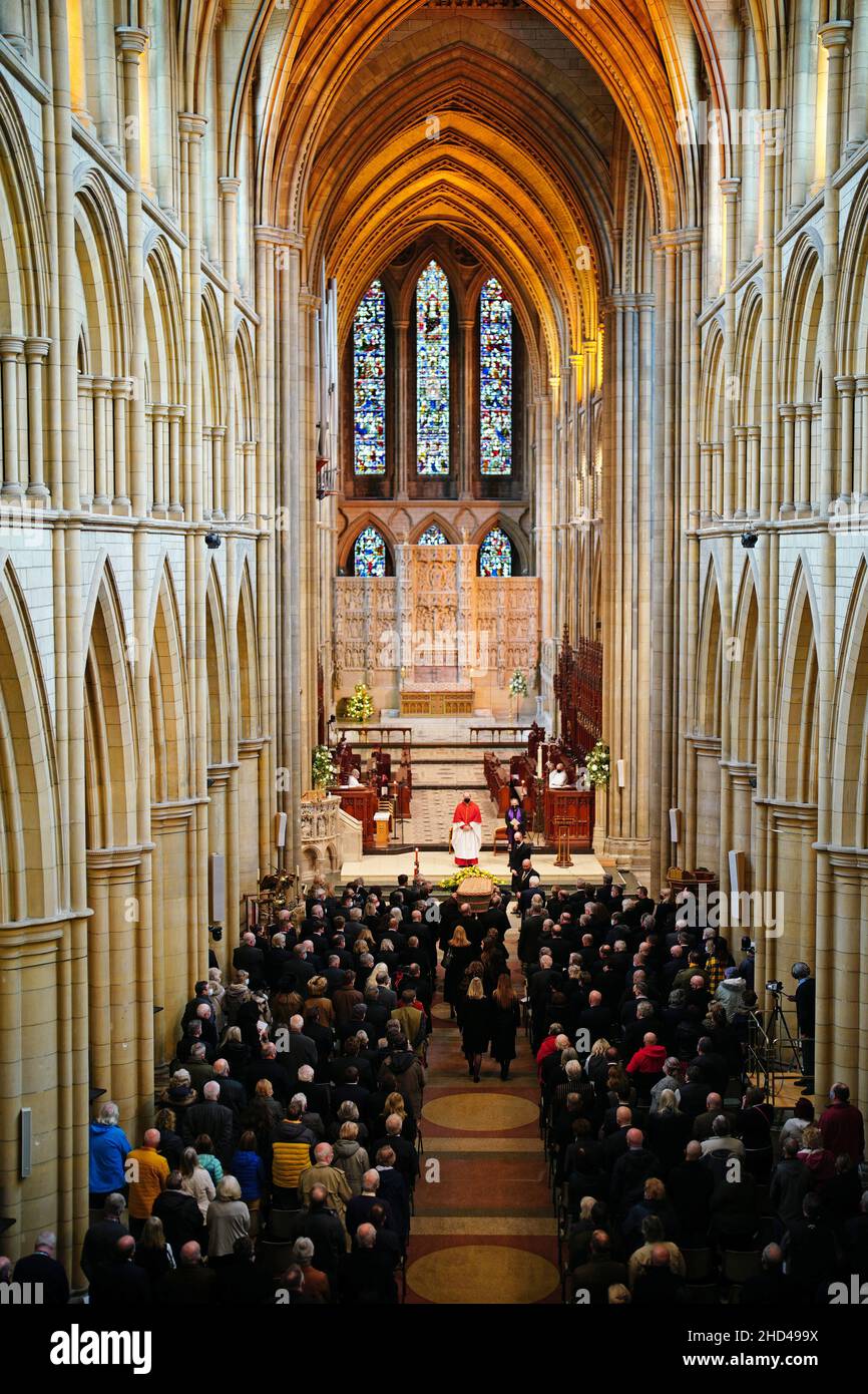 The coffin is carried into the funeral service of Cornish comedian ...