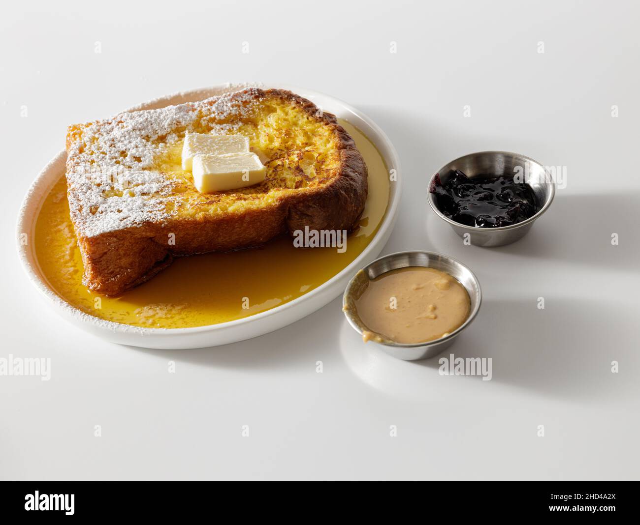 Hot butter melting on fresh piece of bread Stock Photo - Alamy