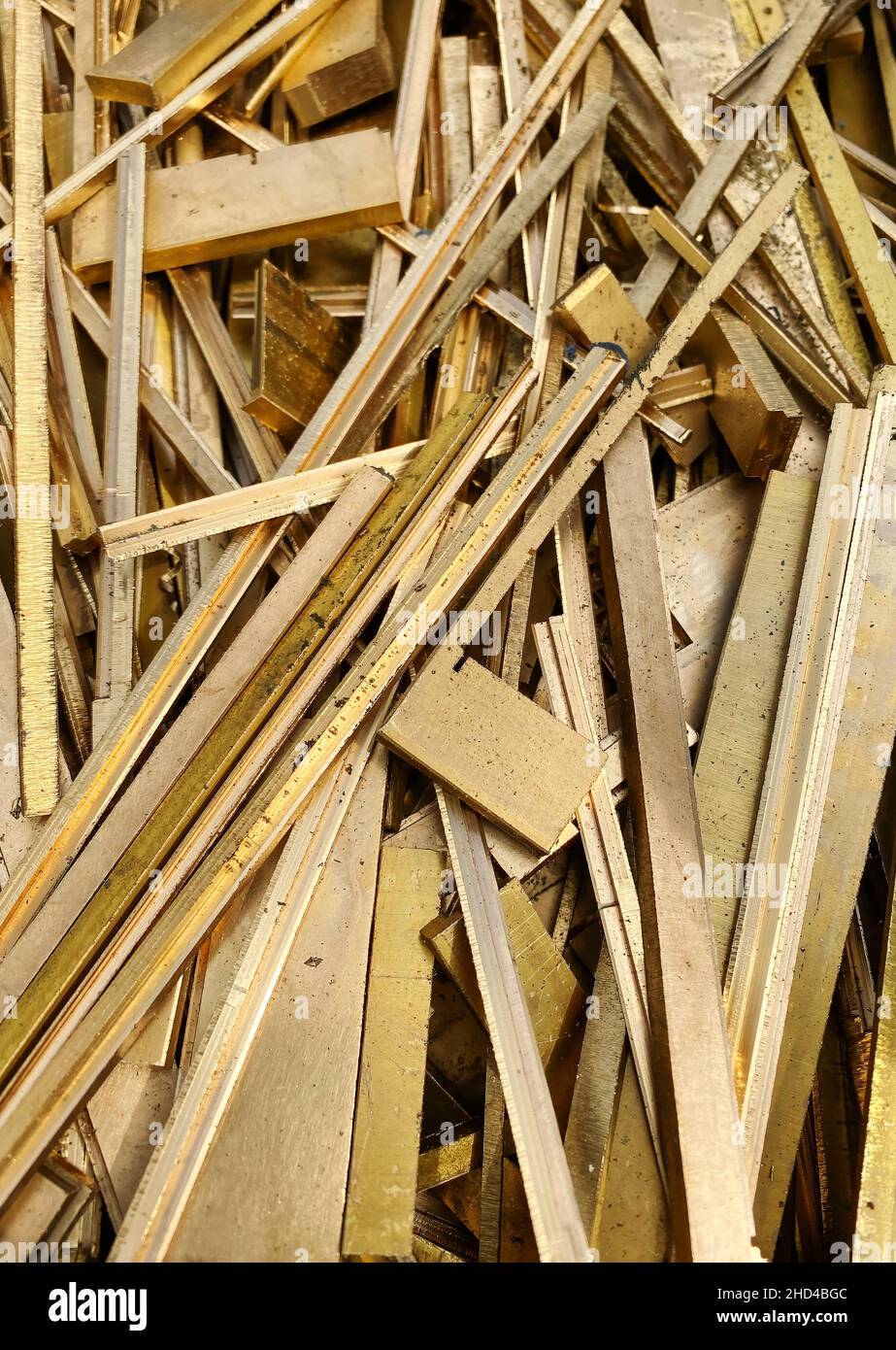 Brass rods and strips waste from industrial manufacturing process. High ...