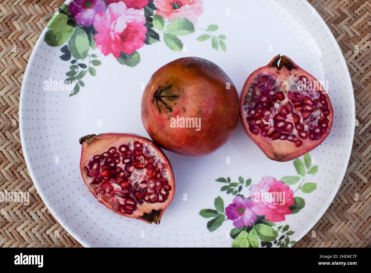 Fresh Pomegranate fruit, whole and cut chopped for seeds, indian asian ...