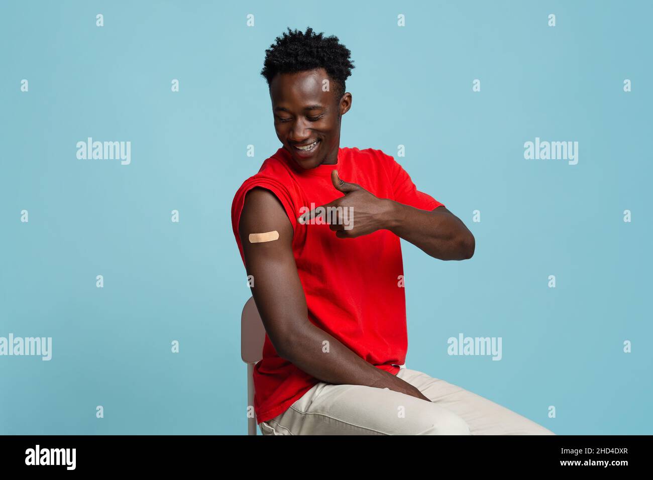 Covid-19 Vaccination. Black Man Pointing At Arm After Receiving ...