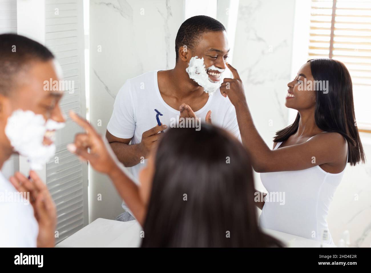 Happy Black Couple Having Fun While Getting Ready Together In Bathroom ...