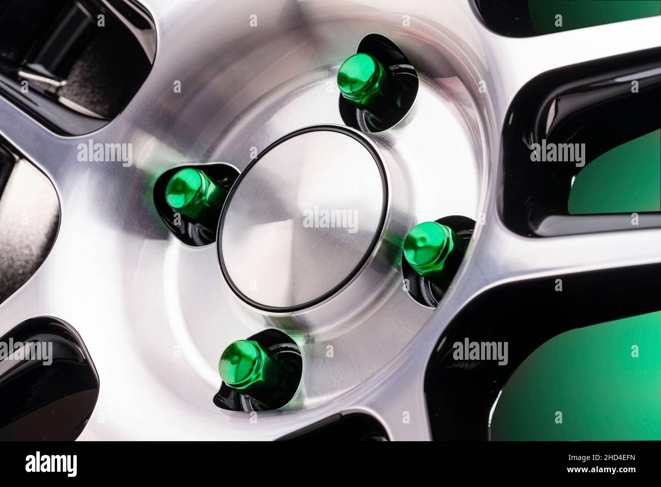 beautiful bright automotive wheel heptahedral nuts green close up on a ...