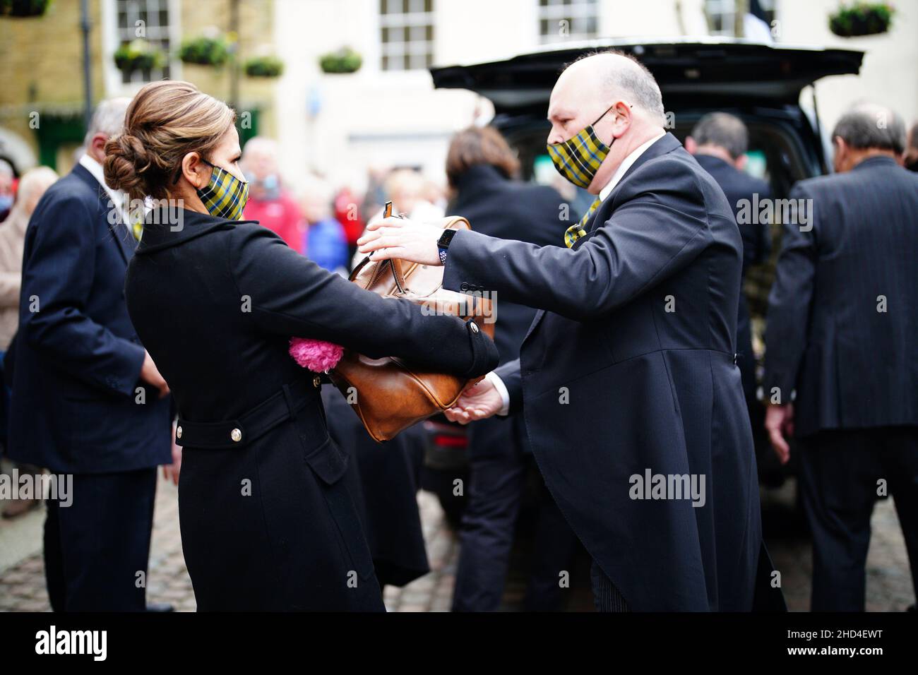 A lady carries a bag which belonged to Cornish comedian Jethro ...