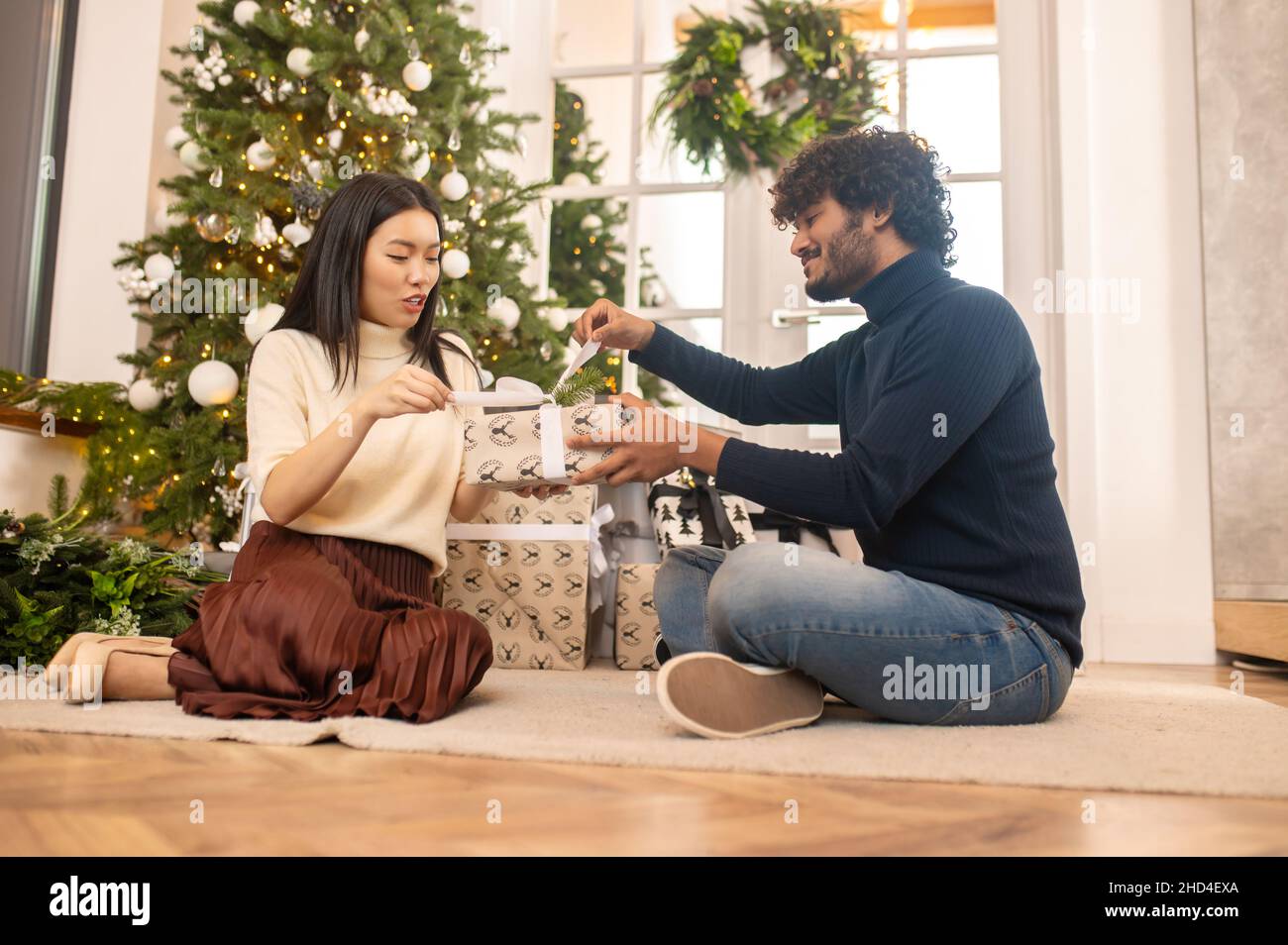 Indian young man giving gift hi-res stock photography and images - Alamy