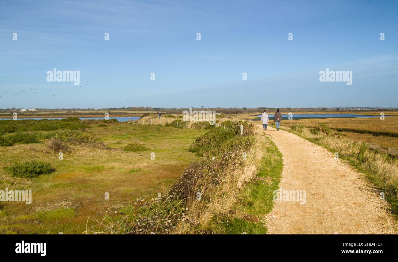 People Walking On The Solent Way Footpath At Keyhaven Looking Towards ...