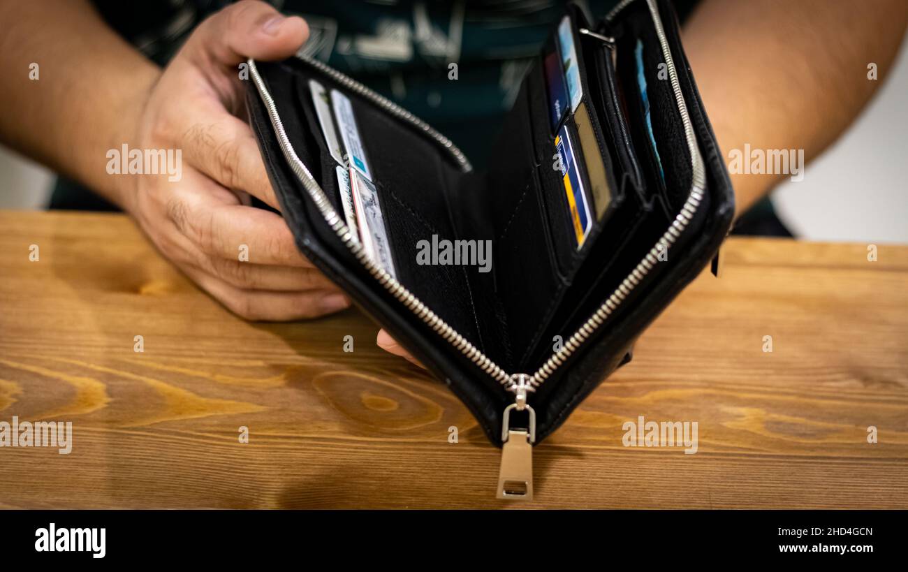 leather wallet on the male hand Stock Photo - Alamy