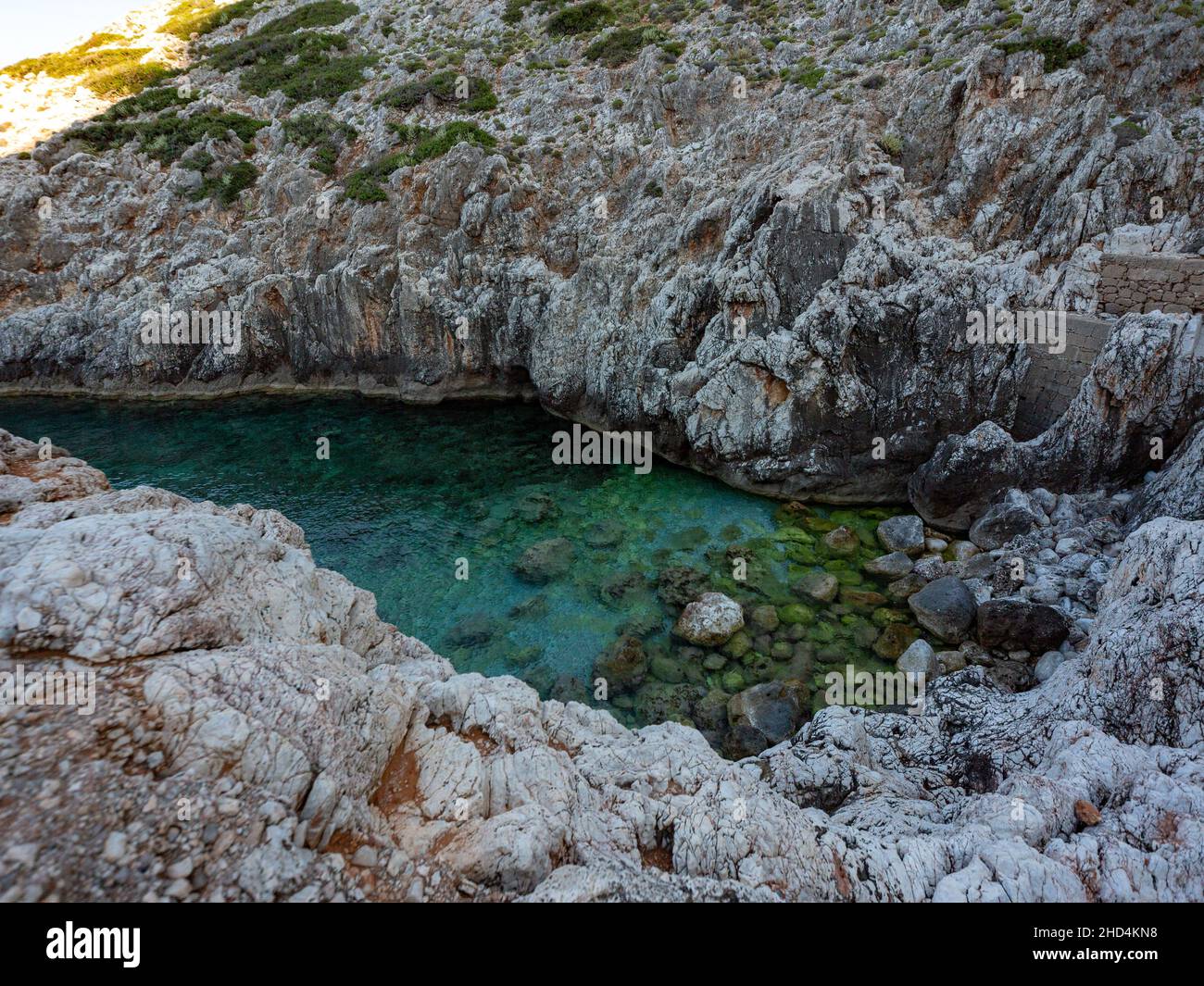 View of a river canal flowing through rocky mountains of the Katholiko ...