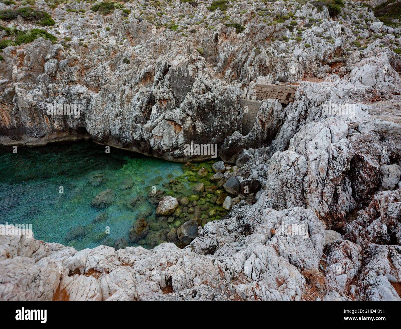 View of a river canal flowing through rocky mountains of the Katholiko ...