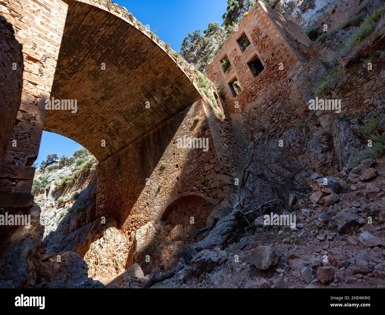 View of an arch and the abandoned Katholiko monastery building in ...
