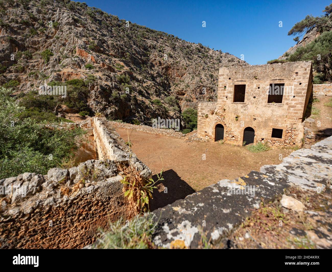 Side view of the abandoned Katholiko monastery building in mountains in ...