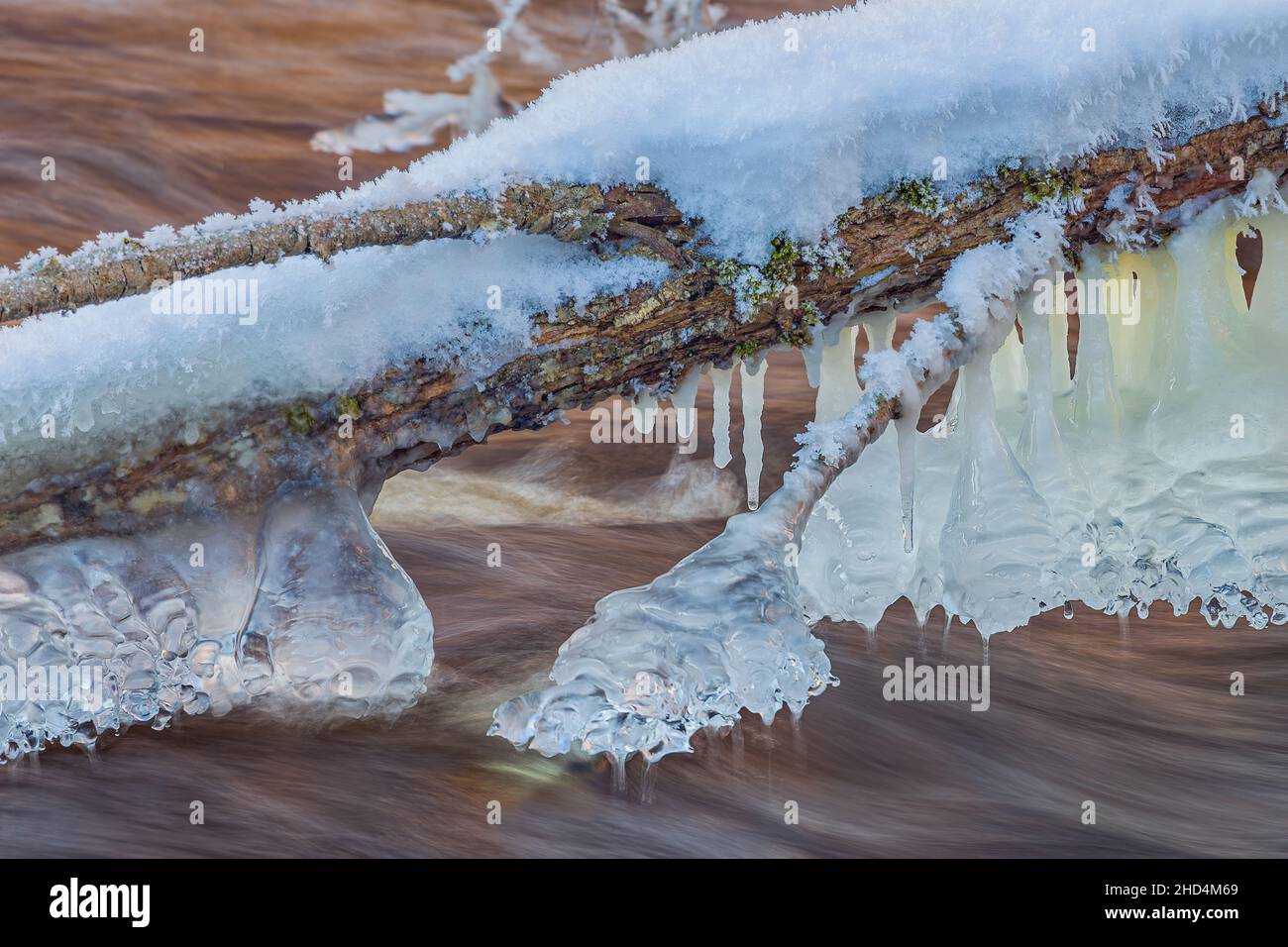 Icicles over the water in the river. Natural landscape. Winter ...