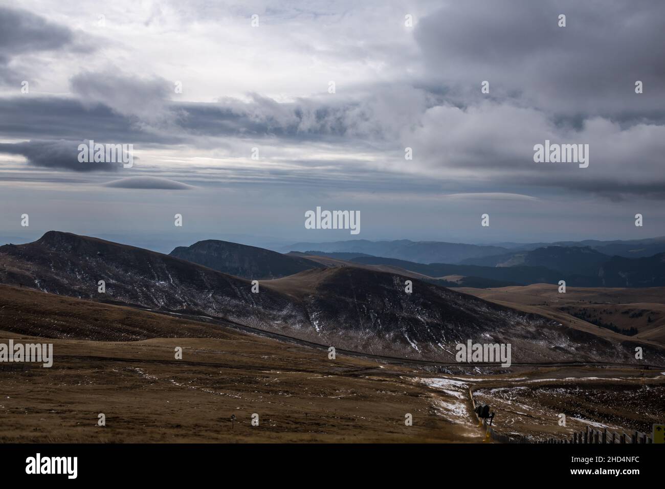 Scenic view from high altitude to mountains under a blue cloudy sky ...