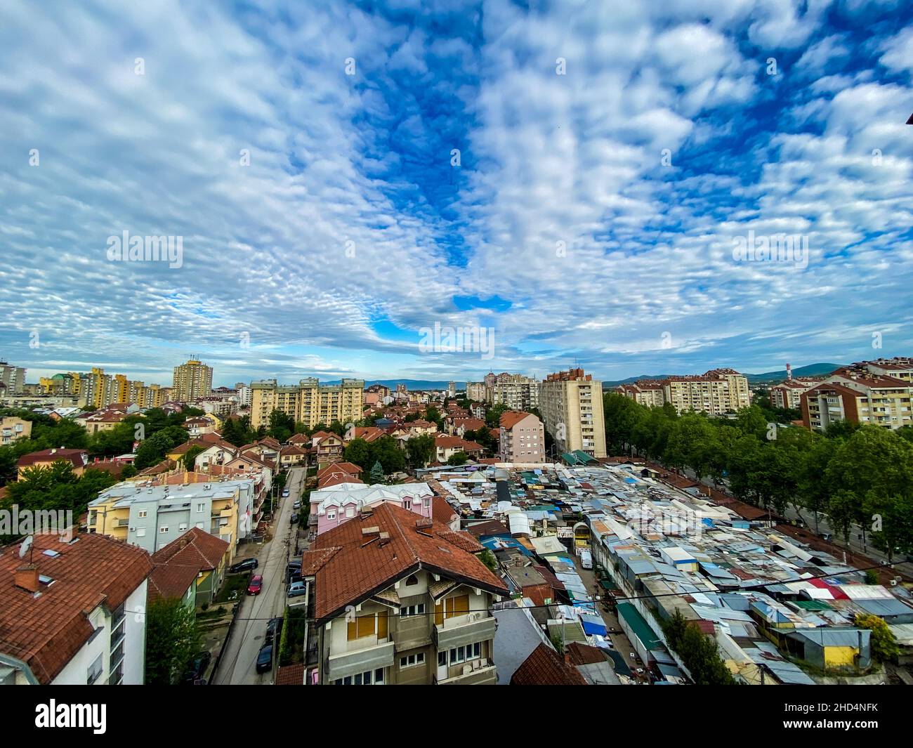 Group of old communism style buildings next to open market Stock Photo ...