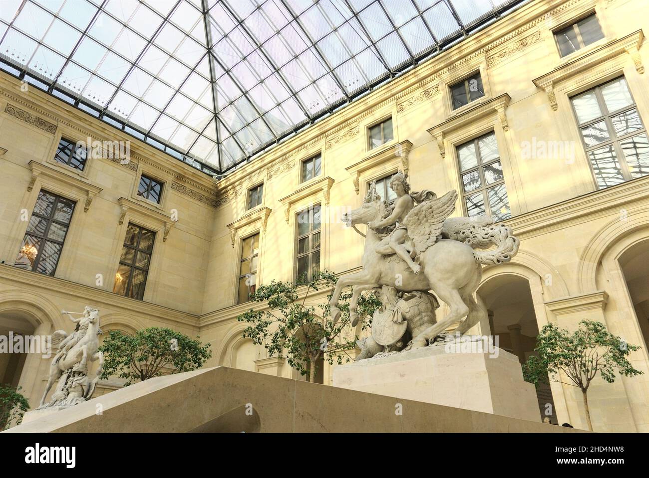 Sculptures in the Cour Marly glass-roofed courtyard inside the Louvre ...