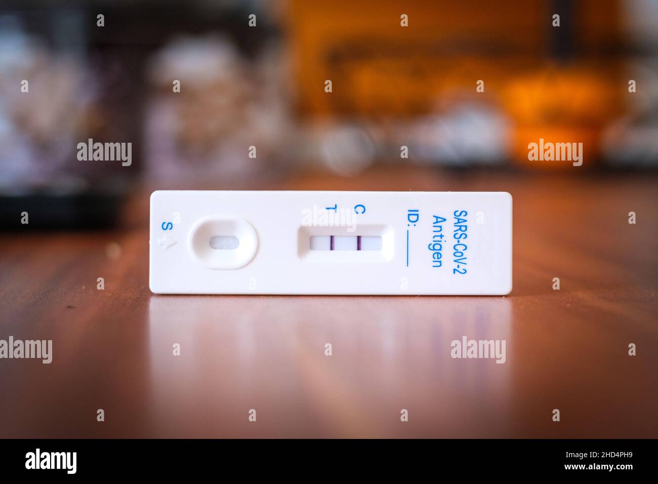 on the table there is a positive Corona rapid test Stock Photo - Alamy