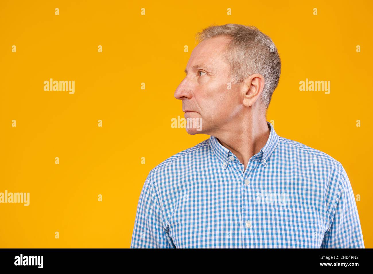 Serious mature man posing looking aside at studio Stock Photo - Alamy
