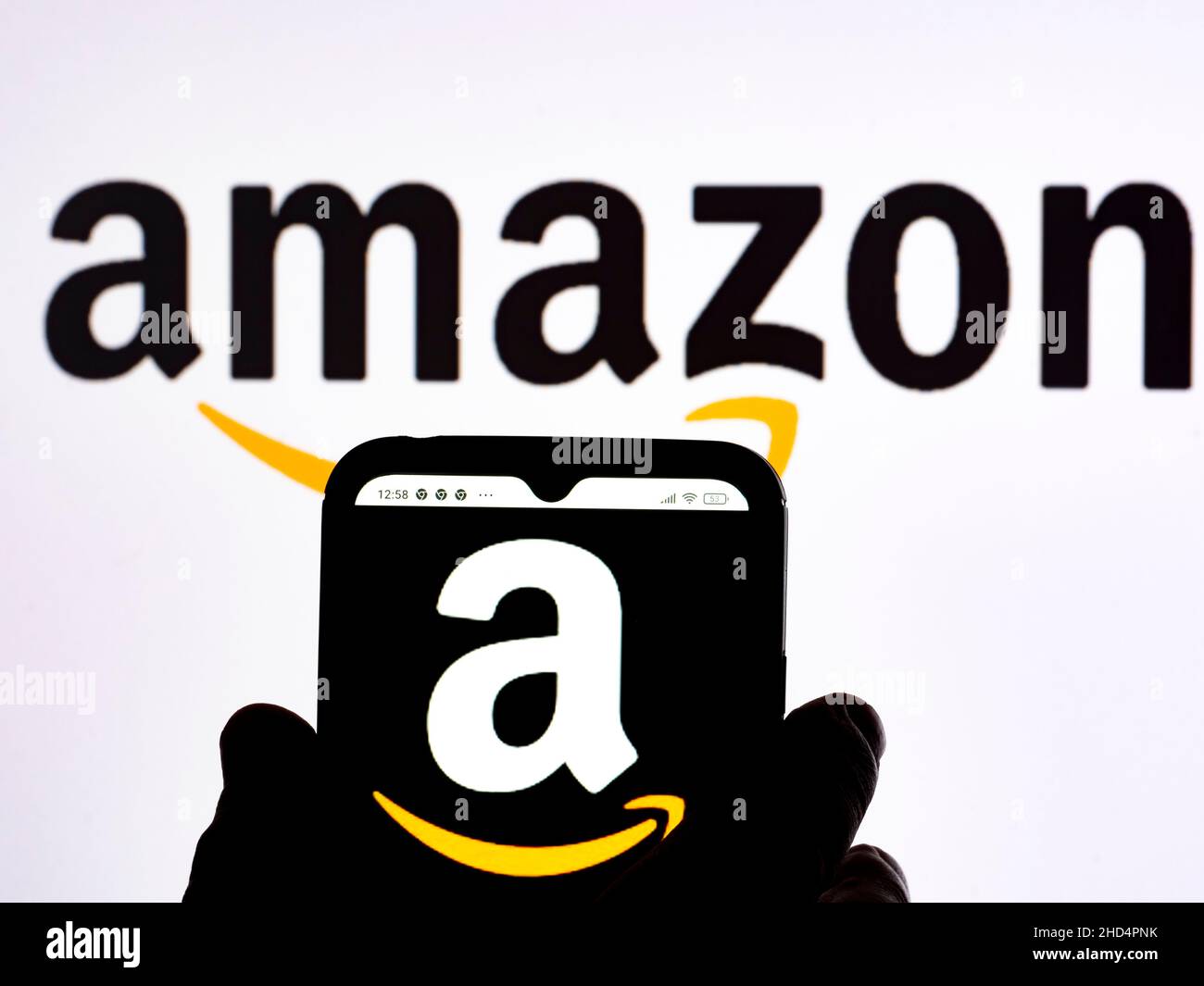 In this photo illustration Amazon logo seen displayed on a smartphone ...