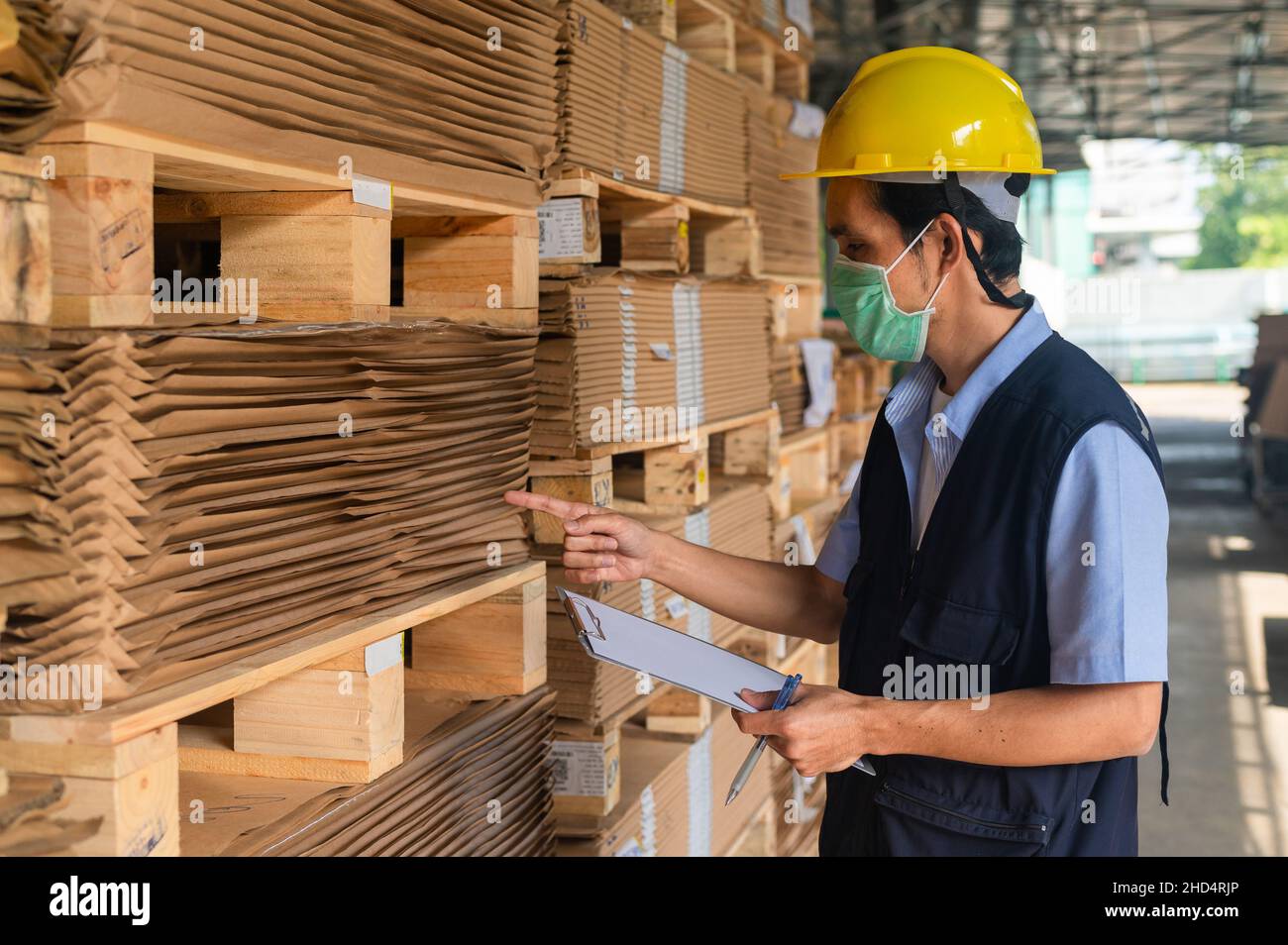 Worker checking raw material in store for factory industrial, Safety ...