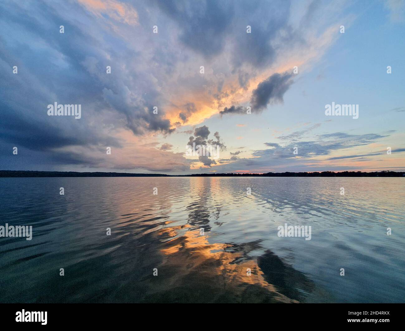 Beautiful breathtaking view of a lake and the sky with clouds and their ...