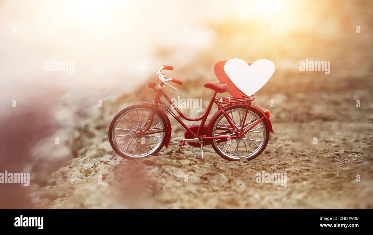 bike is parked and there is a heart shape on top. concept of love of lovers on Valentine's Day ...