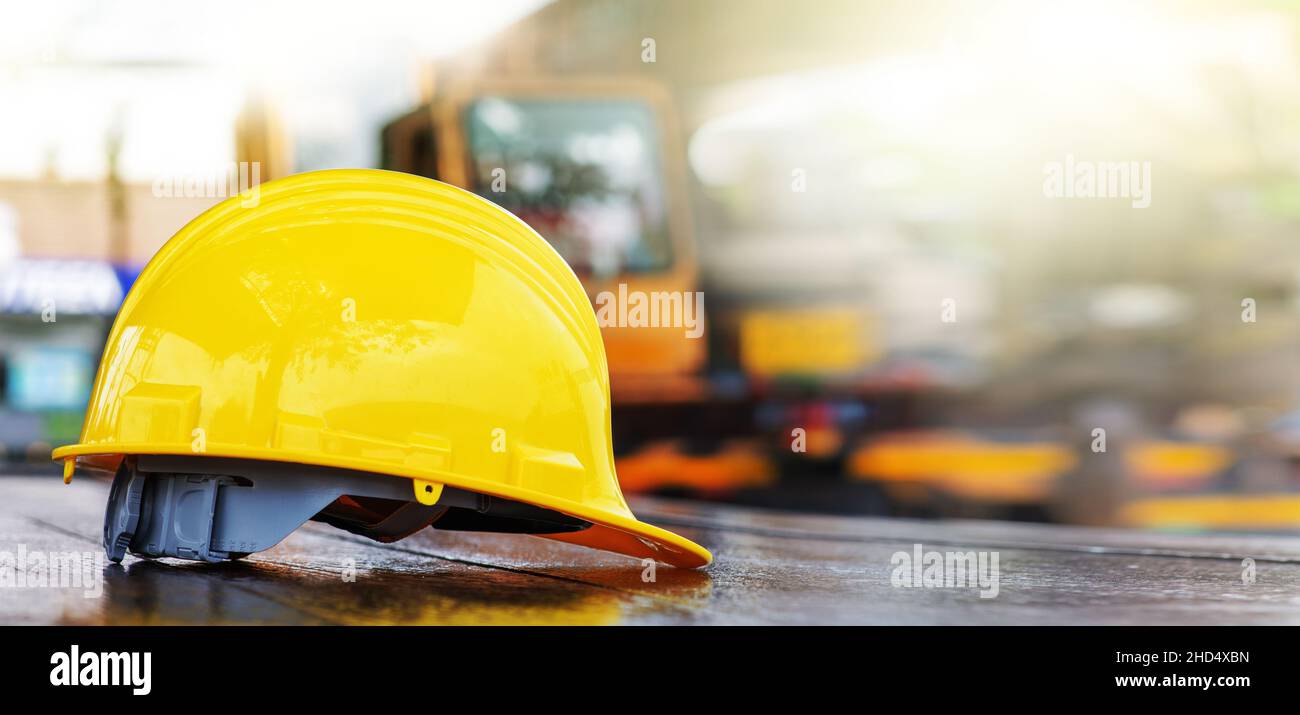 Yellow helmet on site construction background, Safety hardhat , Hard ...