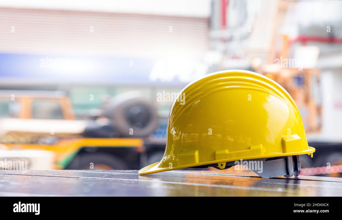 Yellow helmet on site construction background, Safety hardhat , Hard ...