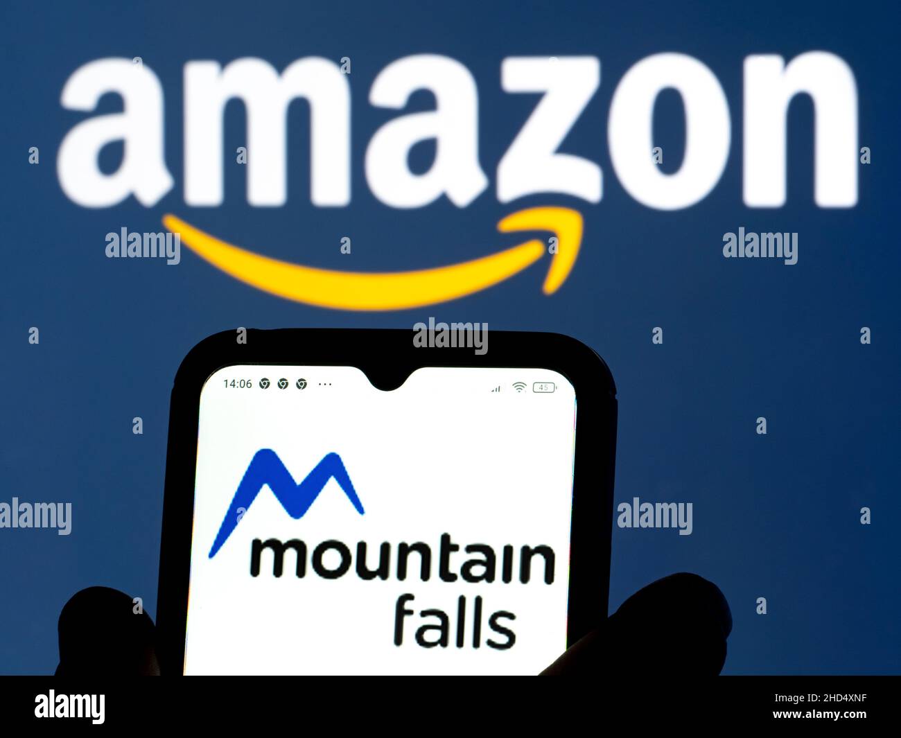 In this photo illustration Mountain Falls brand owned by Amazon logo ...