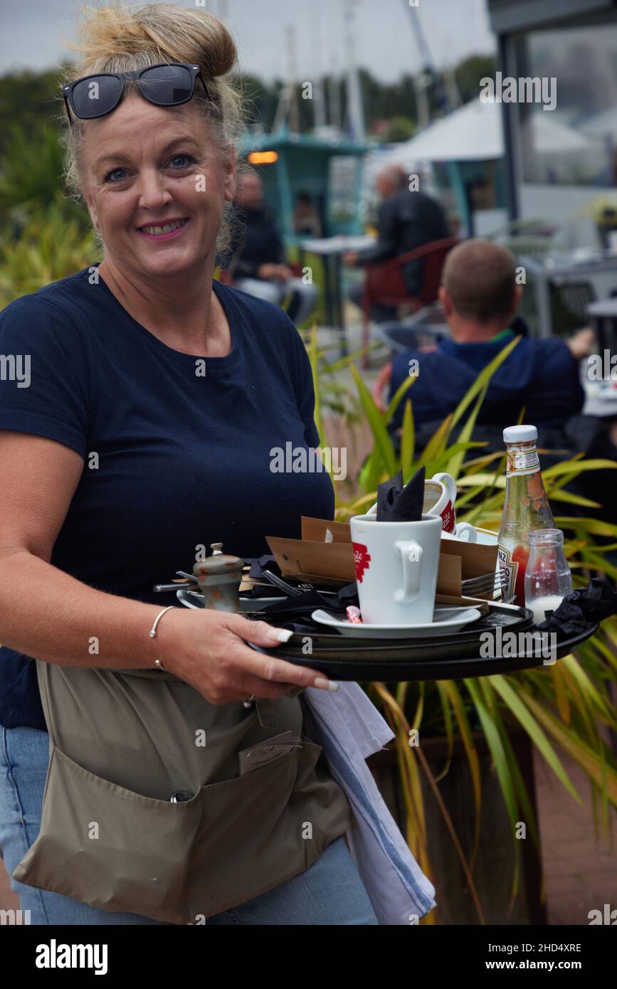 Happy waitress uk hi-res stock photography and images - Alamy