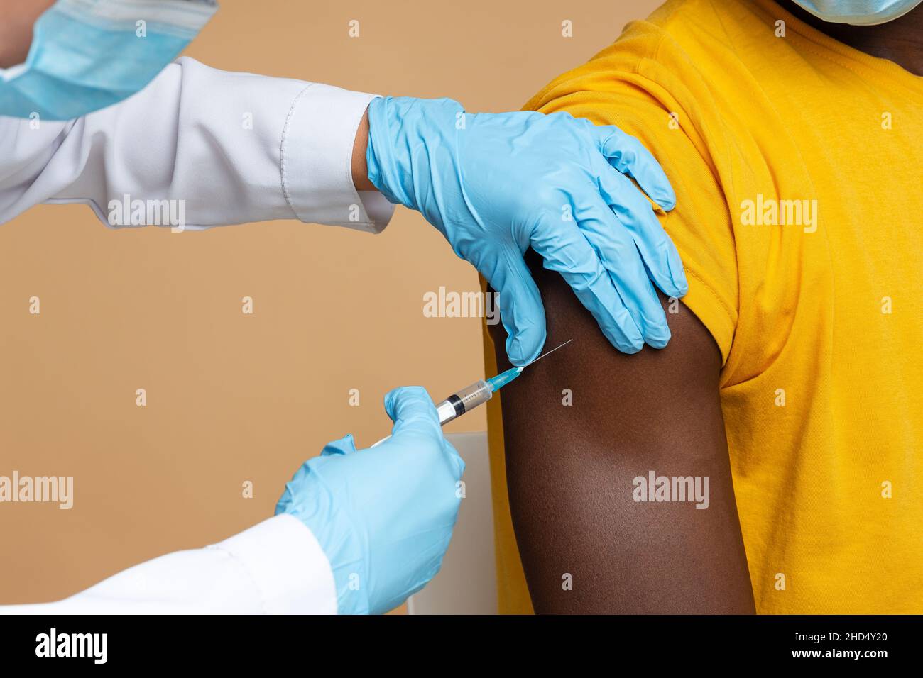 Vaccination Process. Unrecognizable Doctor Making Injection To Black ...