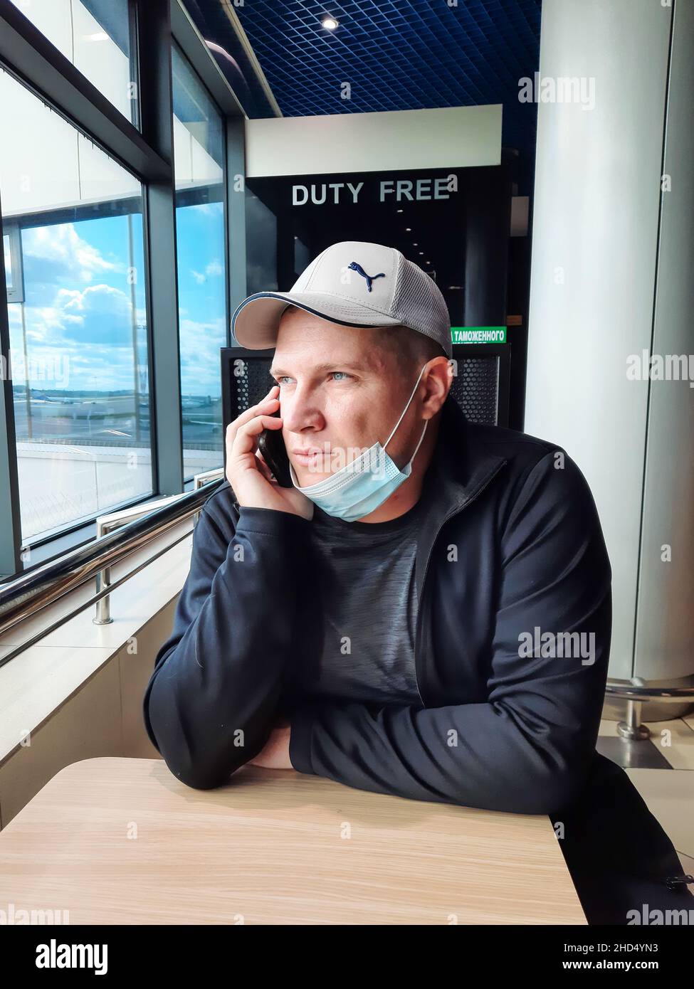 Minsk Belarus October 2021. A man talking on the phone at the airport ...