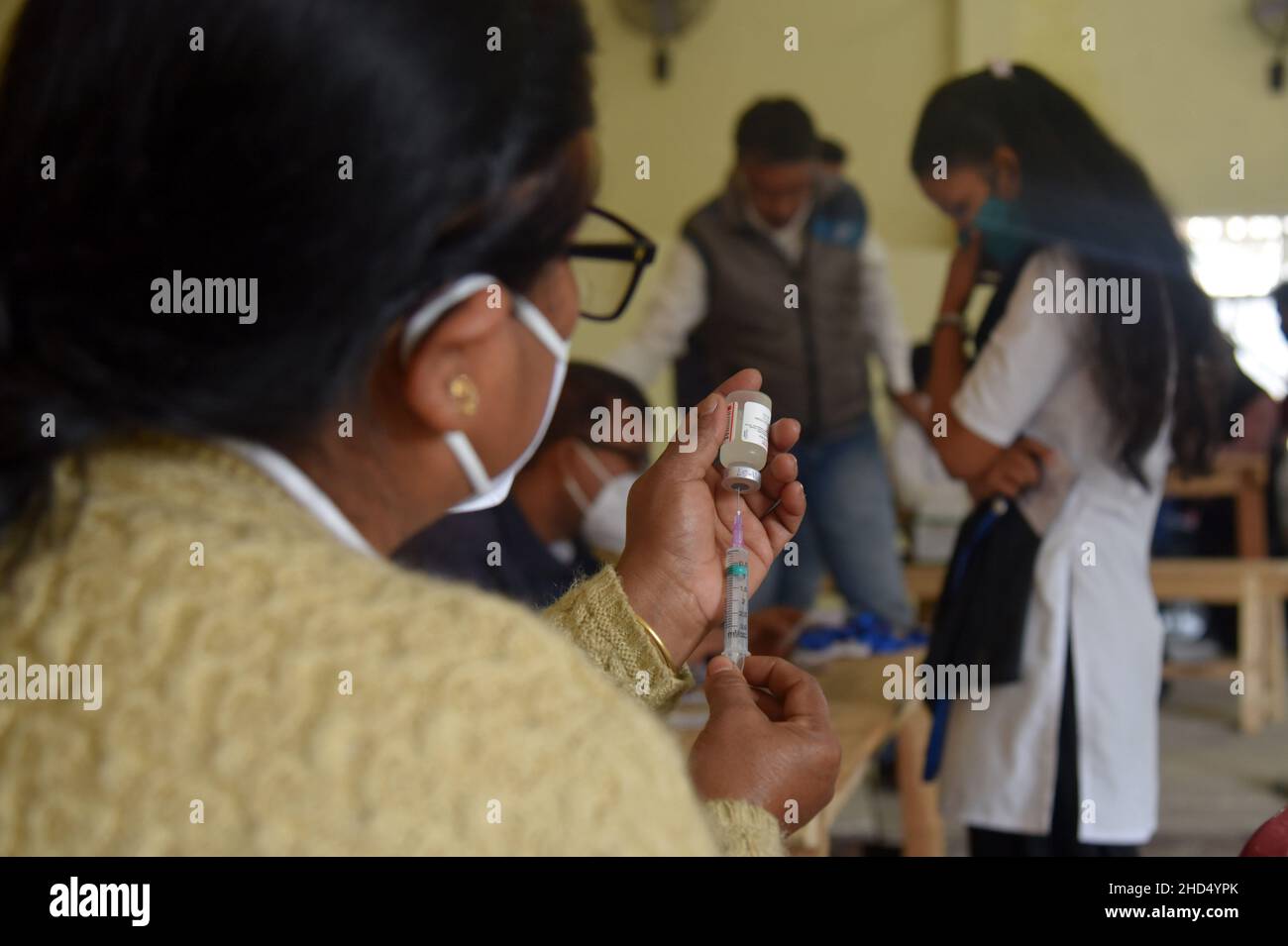Guwahati, Guwahati, India. 3rd Jan, 2022. A nurse gets ready to inject ...
