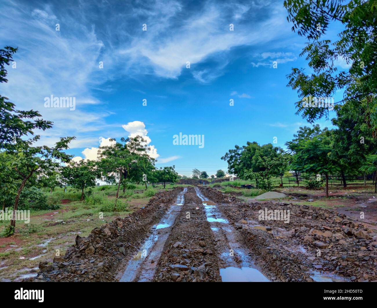 Stock photo of messy muddy dirt road after heavy rain with deep tire ...