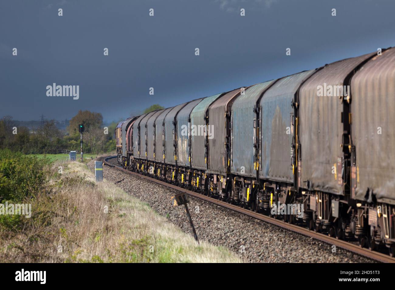 Freight train approaching a green or clear railway signal at Stoke ...