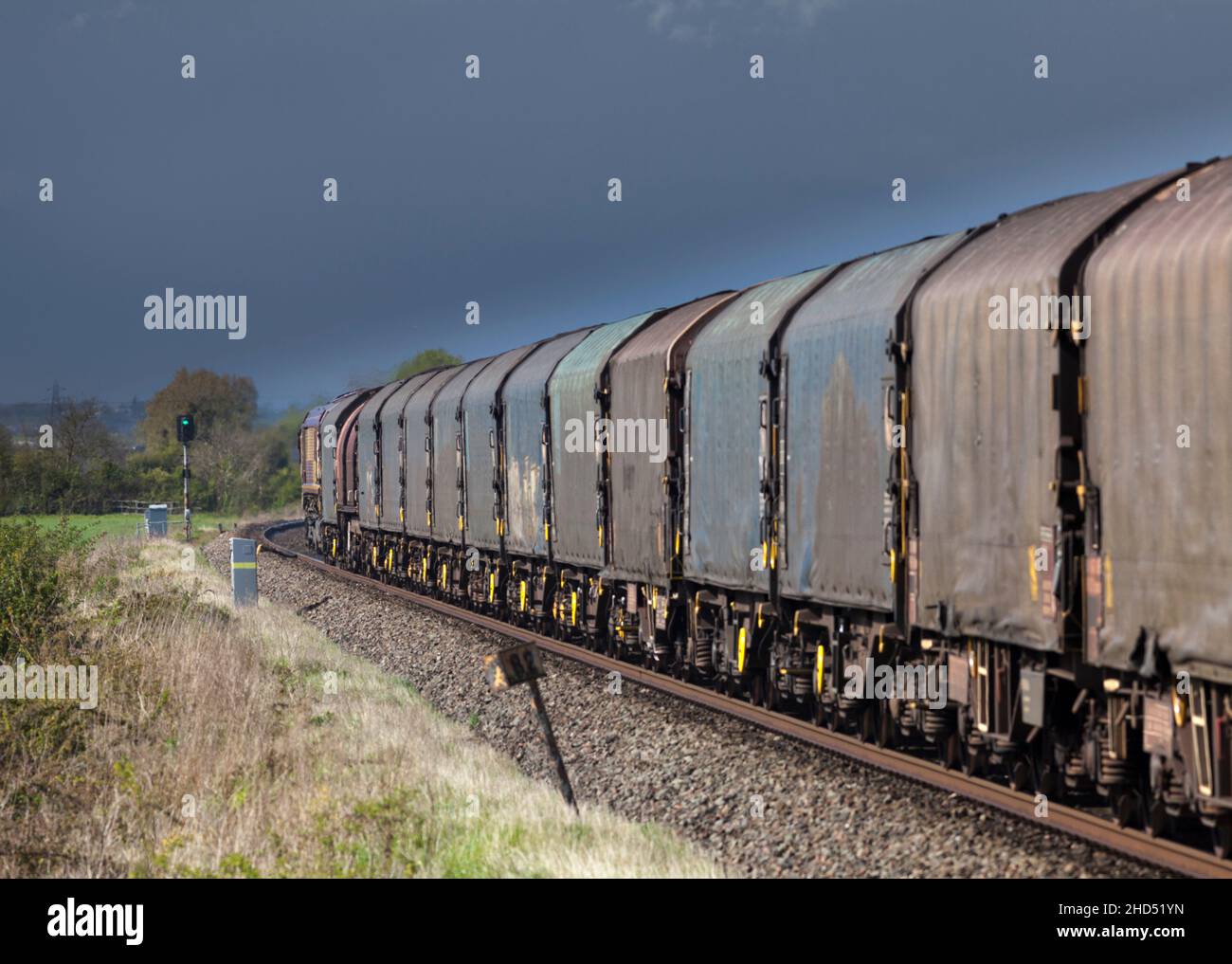 Freight train approaching a green or clear railway signal at Stoke ...