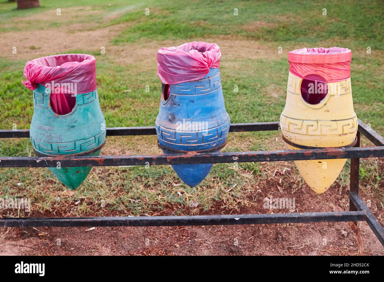 Clay pots of blue, yellow and green colors for Paper, Plastic, Metal ...